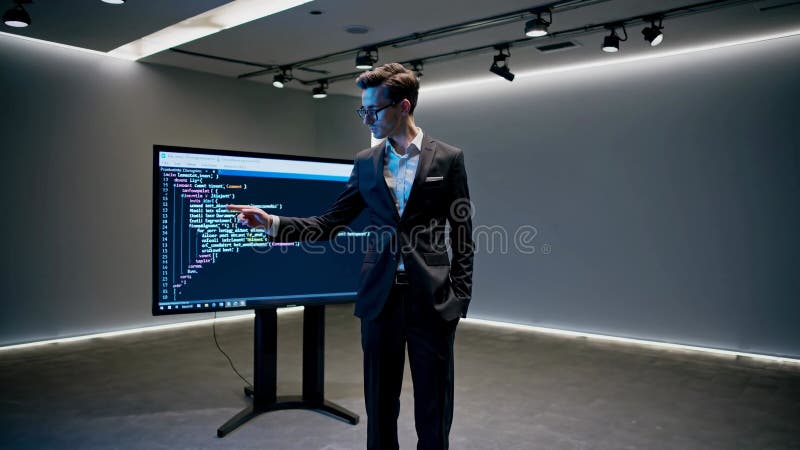 Professional Businessman Presenting Digital Code on Screen in ...