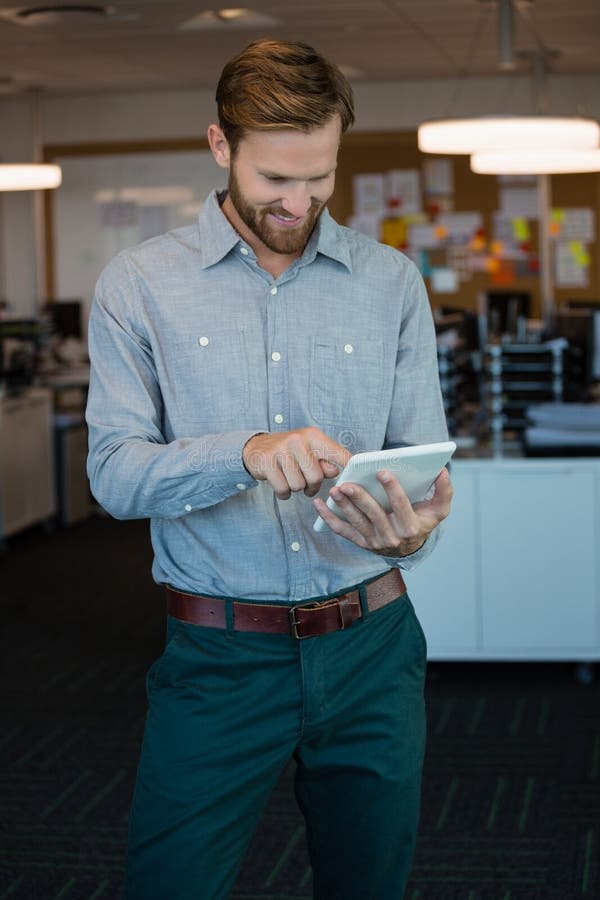 Male Executive Using Digital Tablet in Office Stock Photo - Image of ...