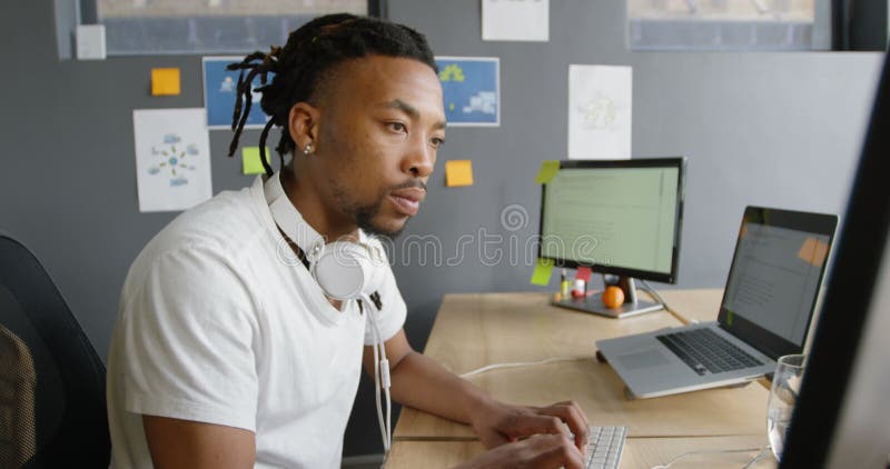 Male Executive Working on Computer at Desk in Office Stock Image ...