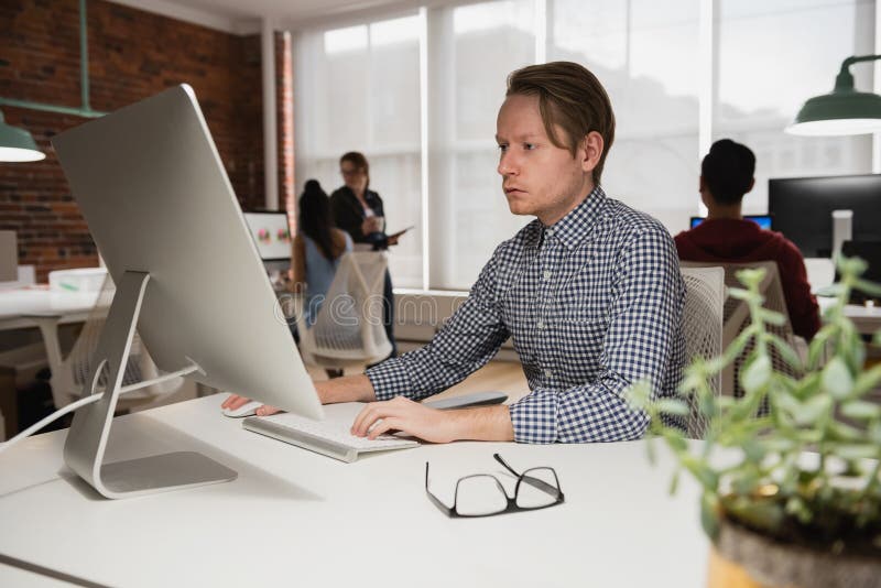 Male Executive Working on Computer in Office Stock Photo - Image of ...