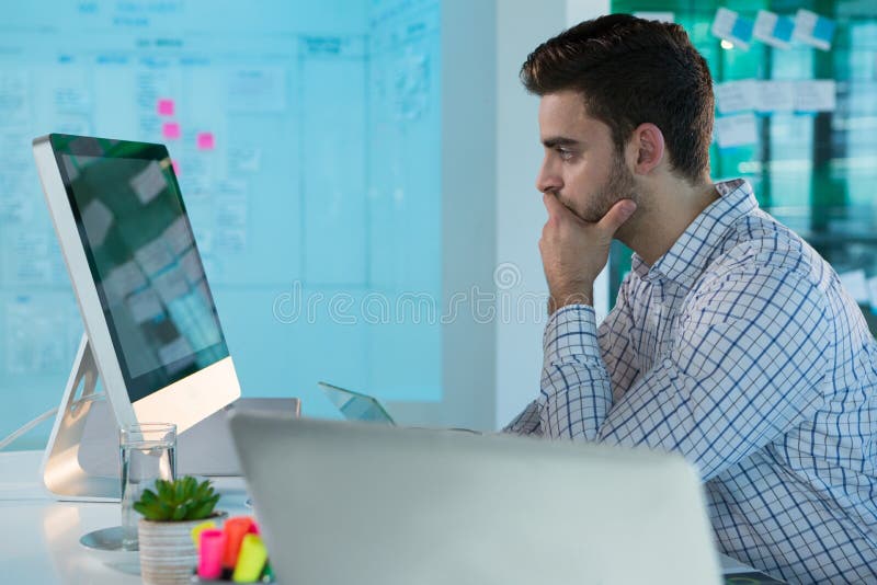 Male Executive Working on Personal Computer at Desk Stock Image - Image ...