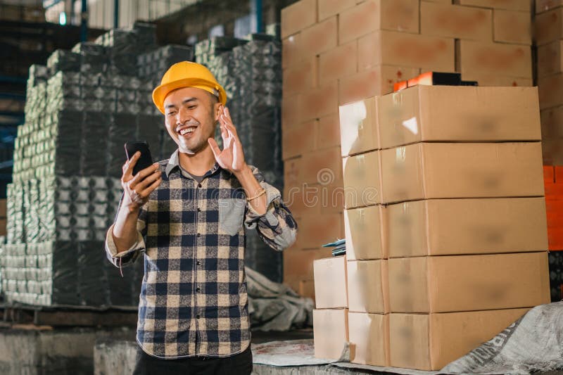 Male Factory Worker Makes Video Call with Cell Phone while Working ...