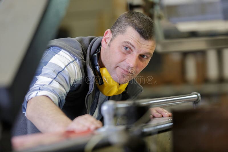 Male Factory Worker Using Industrial Machine Stock Image - Image of ...