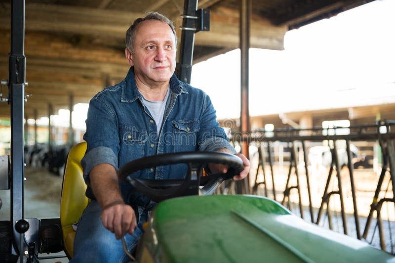 Male farm owner on tractor stock image. Image of husbandry - 265059553