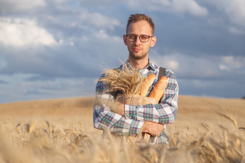 Male Farmer or Baker with Baguettes in Rye, Wheat Field Stock Photo ...