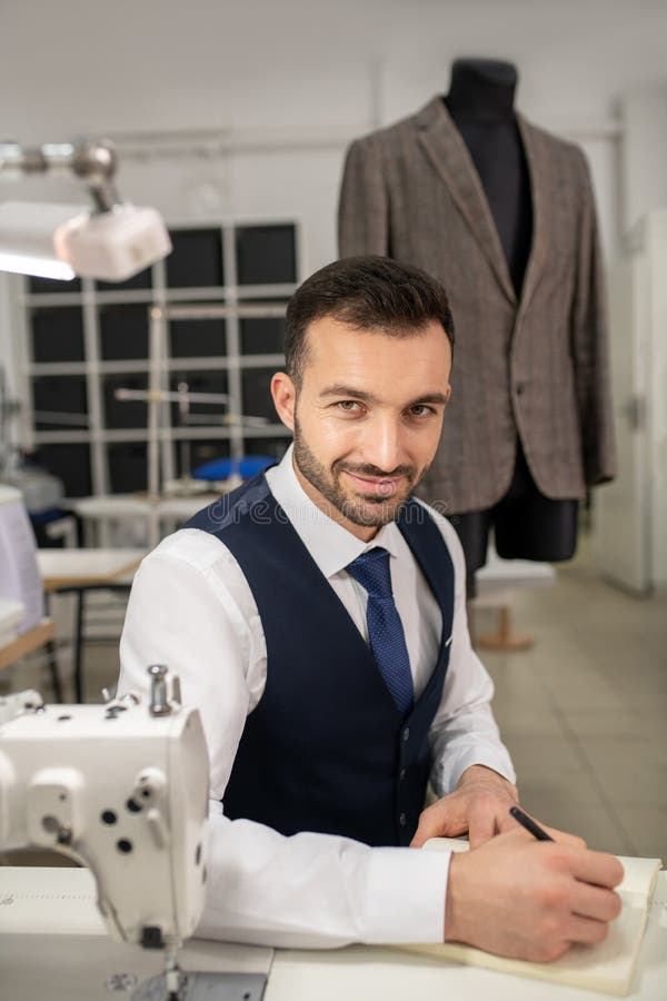 Male Fashion Designer Sitting, Making Notes, Smiling Stock Image ...