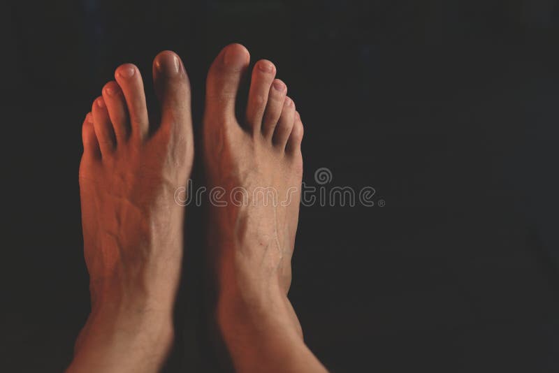 Male Feet in the Dark. Close-up of Man S Bare Feet. Stock Photo - Image ...