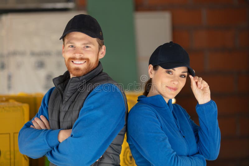 Male and Female Builders Working Together Stock Photo - Image of ...