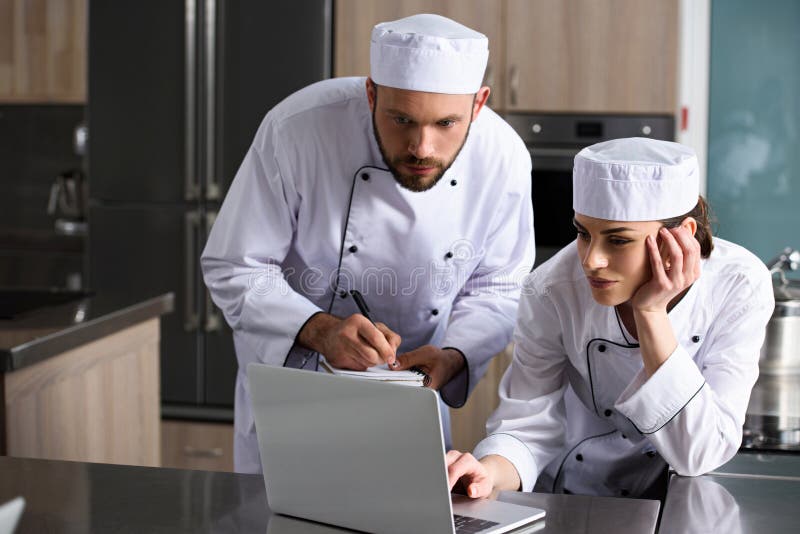 Chefs Using Digital Tablet in Kitchen Stock Image - Image of industry ...