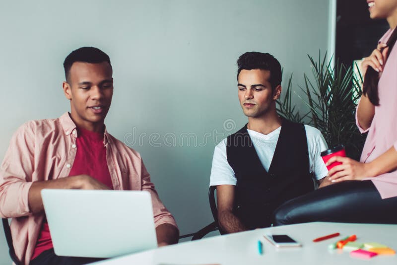 Male and Female Colleagues Collaborating on Course Work from University ...