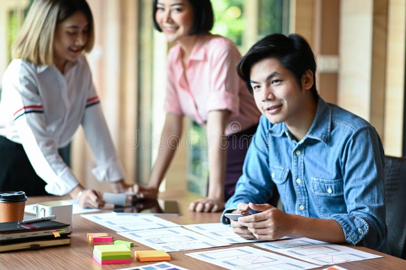 Male and Female Design Team Working Together in Office Stock Image ...