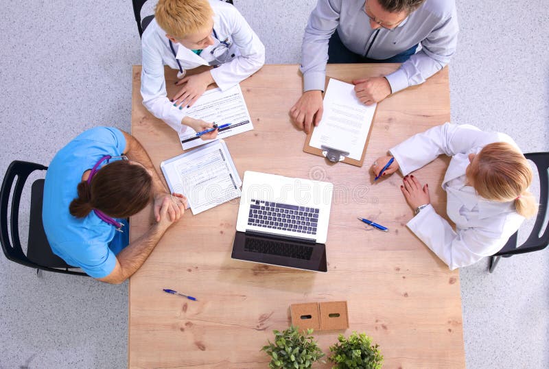 Male and Female Doctors Working on Reports in Medical Office Stock ...