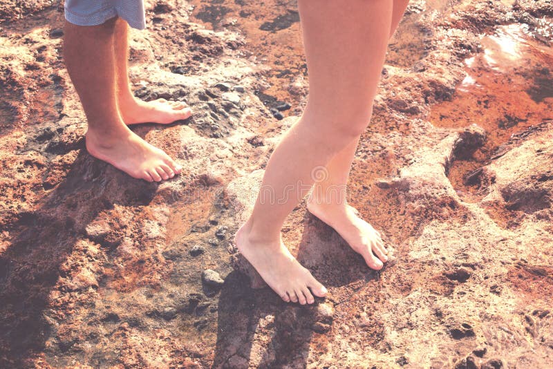 Male And Female Feet Standing On A Wet Stone Stock Image Image Of Brown Foot 138446203