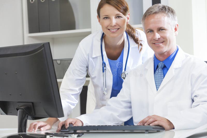 Male Female Hospital Doctors Using Computer Stock Photo - Image of ...