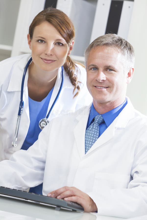 Male Female Hospital Doctors Using Computer Stock Photo - Image of ...