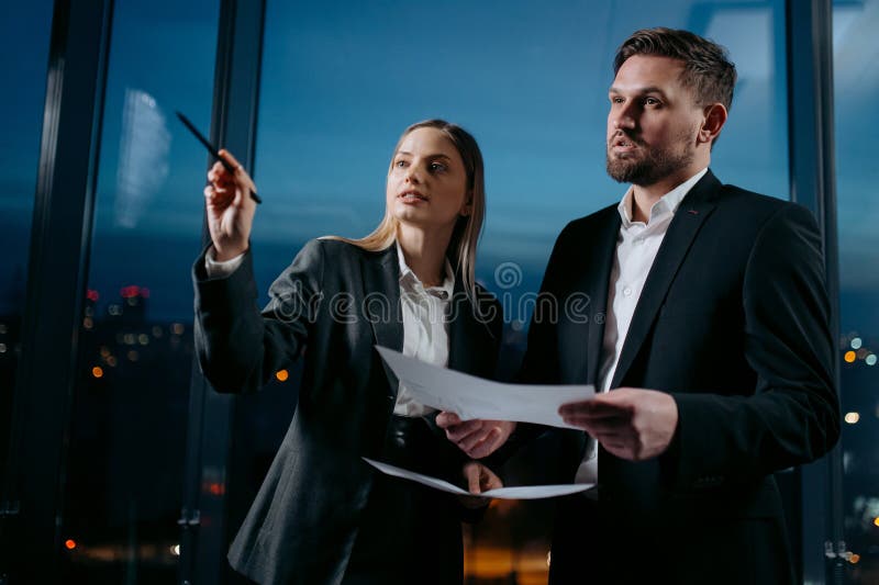Male and Female Office Workers Talking. Business Partners Talking in ...