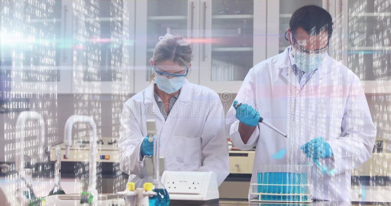 Male and Female Scientists Using Pipettes Mixing Blue Solution in Lab ...