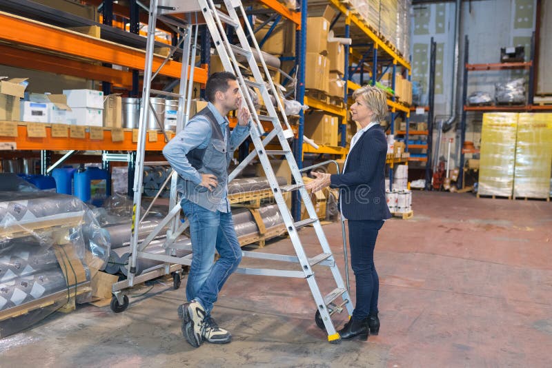 Male and Female Warehouse Workers in Warehouse Stock Photo - Image of ...