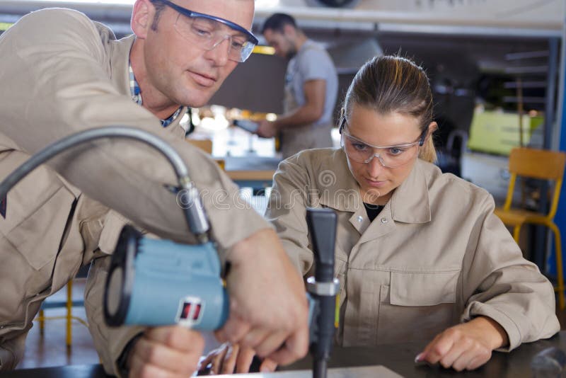 Male and Female Workers in Garage Stock Image - Image of quote, fixing ...
