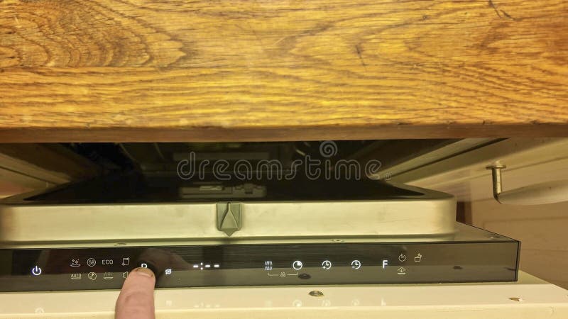 A Male Finger on the Control Panel of the Dishwasher. Changing Cycles ...