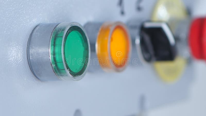 Male Finger is Pressing Green Button on Panel of Multi-colored Buttons ...