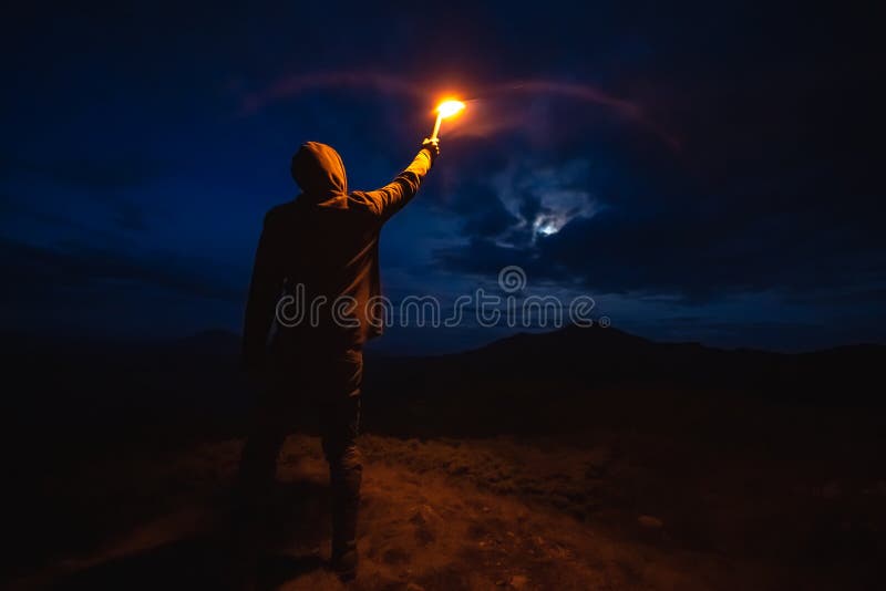 The Male with a Firework Stick Standing on the Night Mountain. Stock ...