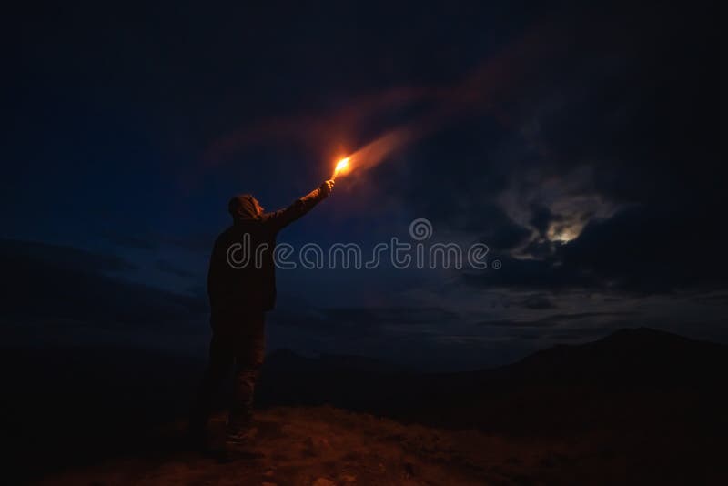 The Male with a Firework Stick Standing on the Night Mountain. Stock ...