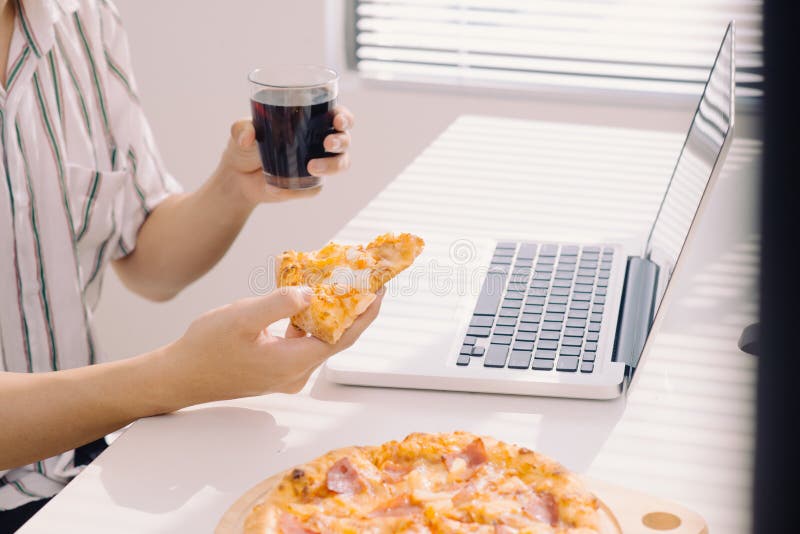 Male Freelancer Eating Pizza while Working at Home Office Stock Image ...