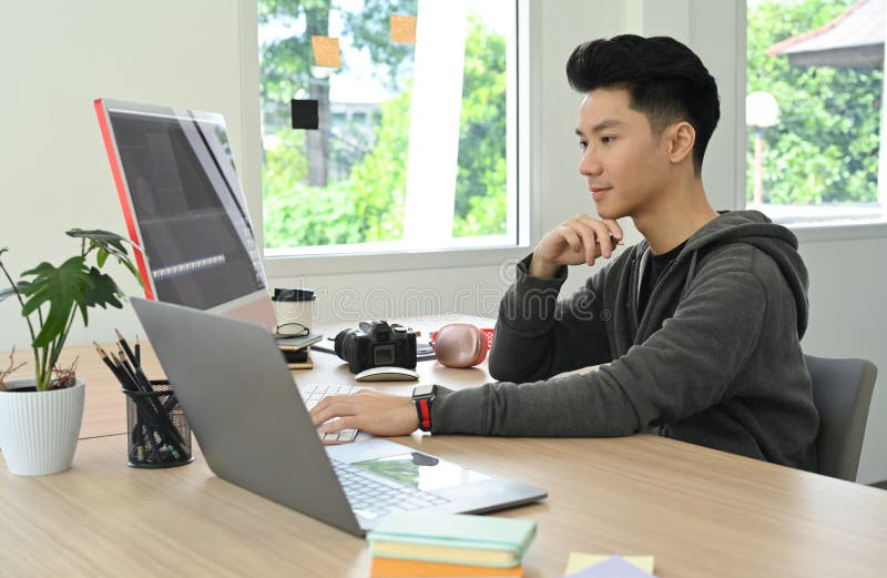 Male Freelancer Editing Film Montage with Audio and Visual Effects at ...