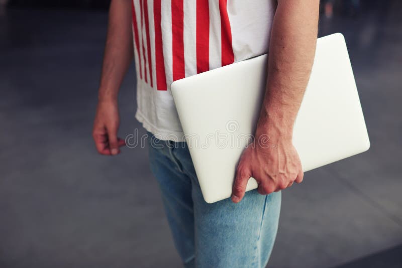 Male Freelancer Holding Close Compact Laptop Computer in the Hand Stock ...
