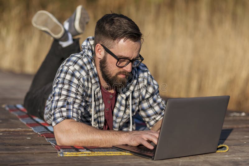 Male Freelancer Working Remotely Stock Photo - Image of nature, holiday ...