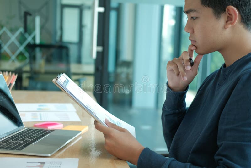 Male Freelancer Working with Document. Startup Man Analyzing Financial ...