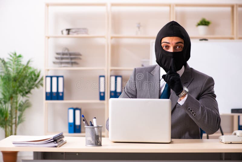 The Male Gangster Stealing Information from the Office Stock Image ...