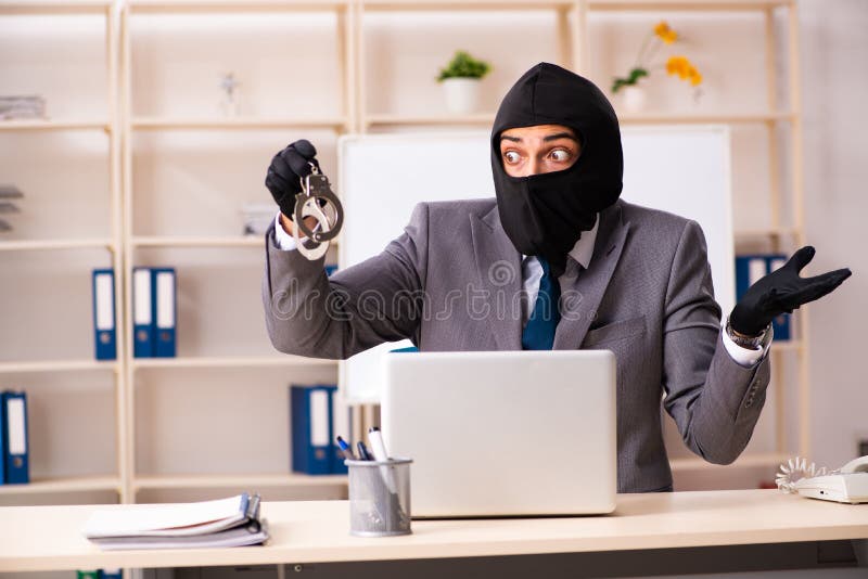 The Male Gangster Stealing Information from the Office Stock Photo ...