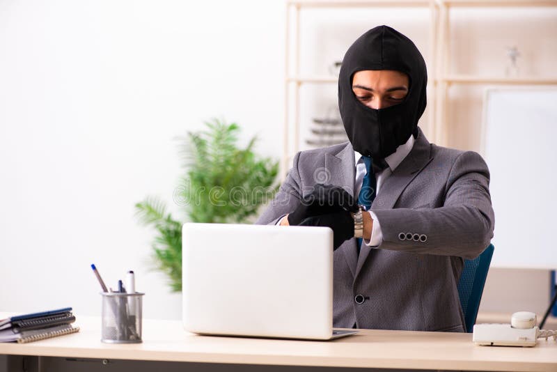 The Male Gangster Stealing Information from the Office Stock Image ...