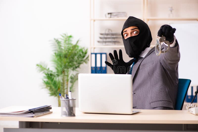 The Male Gangster Stealing Information from the Office Stock Image ...