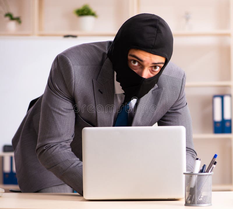 Male Gangster Stealing Information from the Office Stock Photo - Image ...