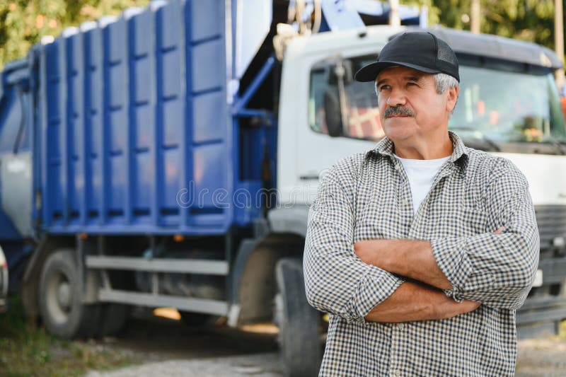 A Male Garbage Truck Driver is Standing Near the Cab Stock Image ...