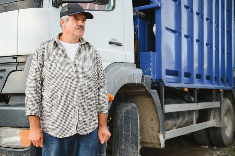 A Male Garbage Truck Driver is Standing Near the Cab Stock Image ...