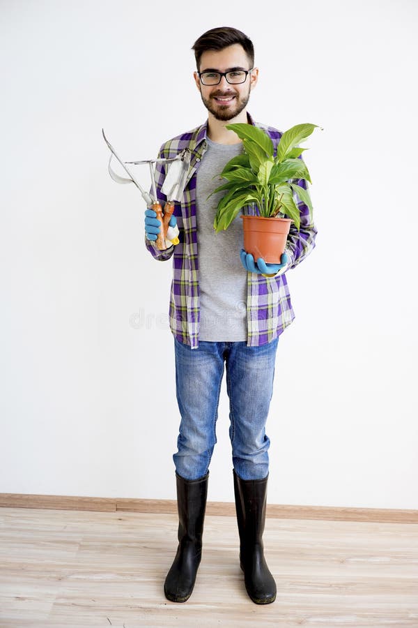 Male gardener with tools stock photo. Image of watering - 97296670
