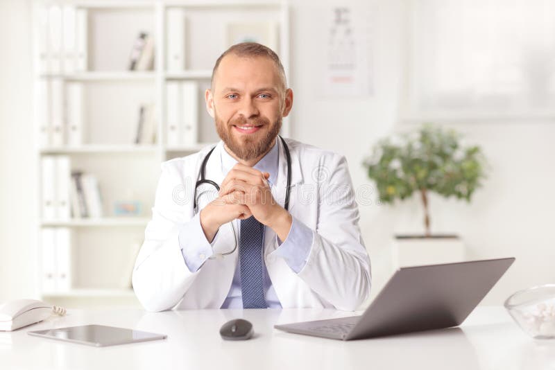 Male General Practitioner Sitting in an Office Stock Photo - Image of ...