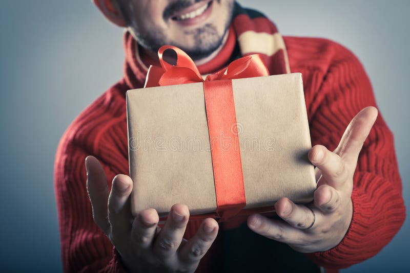 Male giving a gift box stock image. Image of december - 46060059