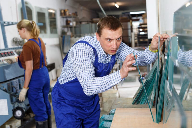 Male Glazier Working in Glass Factory Stock Photo - Image of handling ...