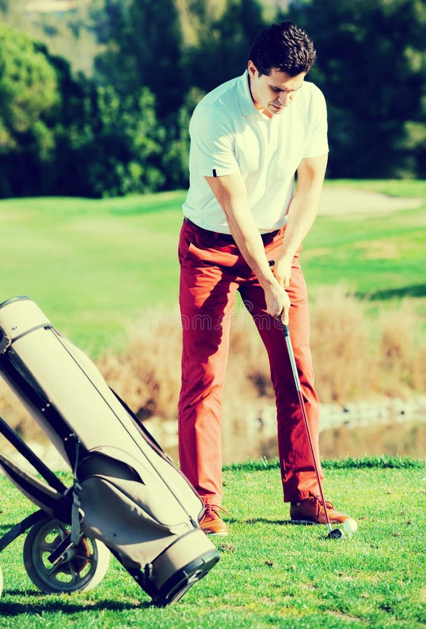 Male golfer at golf course stock image. Image of exercising - 90783161