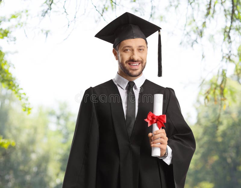 Male Graduate Studend with a Diploma Standing Outdoors Stock Image ...