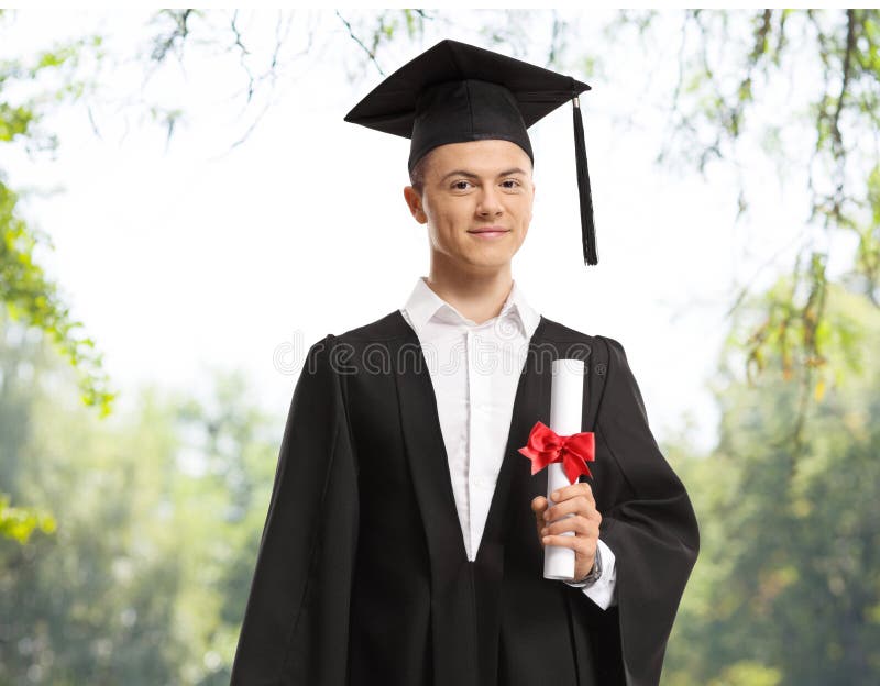 Male Graduate Student Posing in a Park and Holding Diploma Stock Photo ...