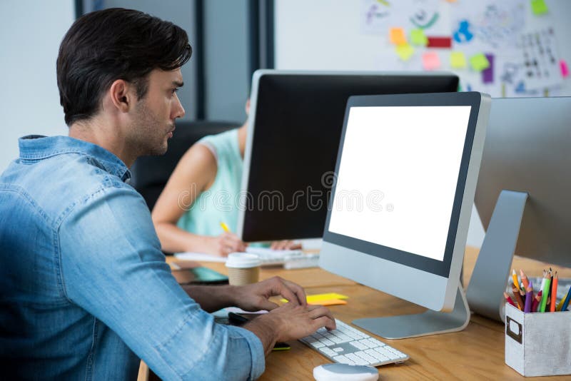Male Graphic Designer Using Graphics Tablet at Desk Stock Photo - Image ...