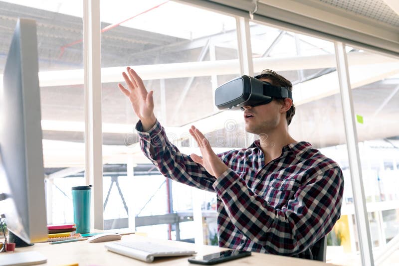 Male Graphic Designer Using Virtual Reality Headset at Desk Stock Image ...