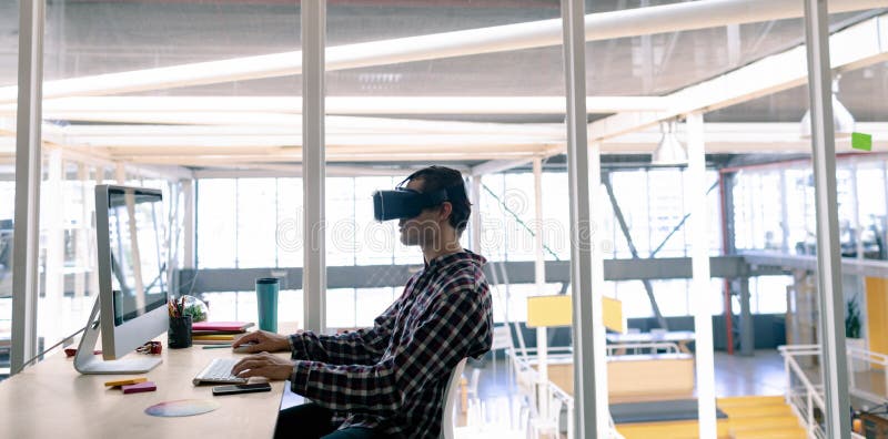 Male Graphic Designer Using Virtual Reality Headset while Working on ...