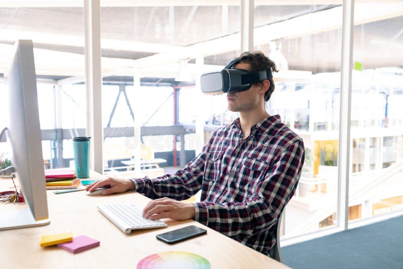 Male Graphic Designer Using Virtual Reality Headset while Working on ...
